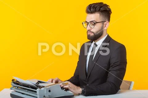 Side view of a young charming male businessman in formal attire and ...