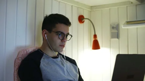 Side view a young man is lying on a bed ... | Stock Video | Pond5