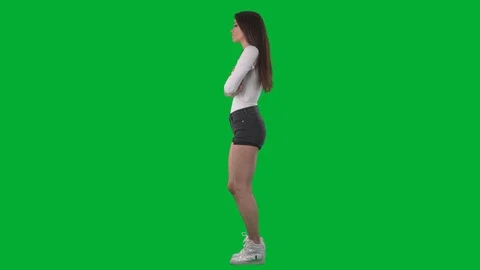 Side view of young woman with crossed ar... | Stock Video | Pond5