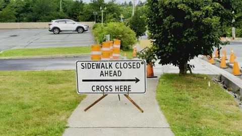 Sidewalk Closed, Cross Here. Caution Sig... | Stock Video | Pond5