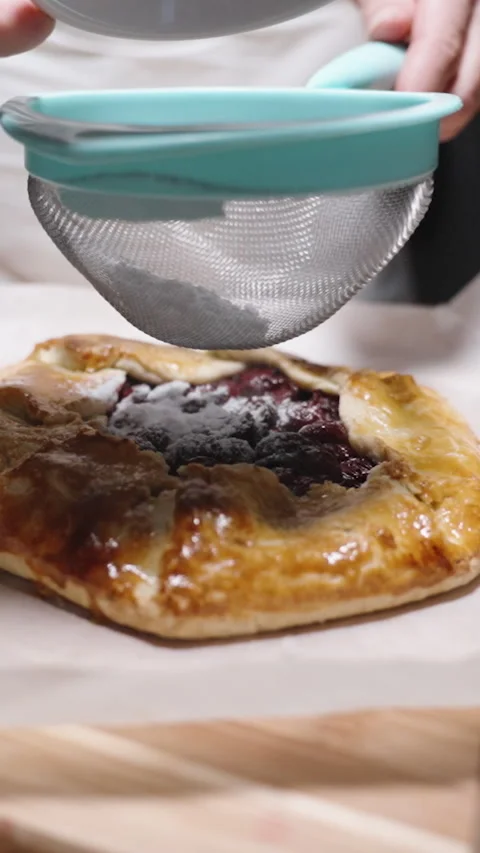 Sifting powdered sugar through a sieve, ... | Stock Video | Pond5