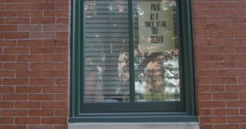 A sign in the window reads, "Police As I... | Stock Video | Pond5