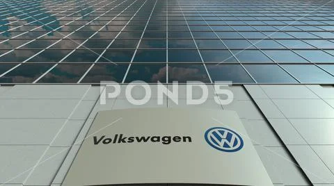 Signage board with Volkswagen logo. Modern office building facade ...