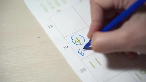 Signing a day on a calendar by red pen. ... | Stock Video | Pond5