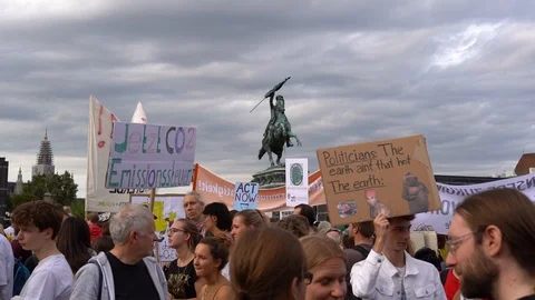 Signs being held up at hero square durin... | Stock Video | Pond5