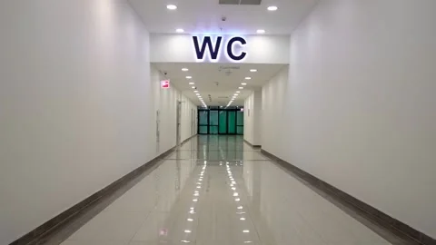 Signs Public toilet WC. Long corridor of... | Stock Video | Pond5