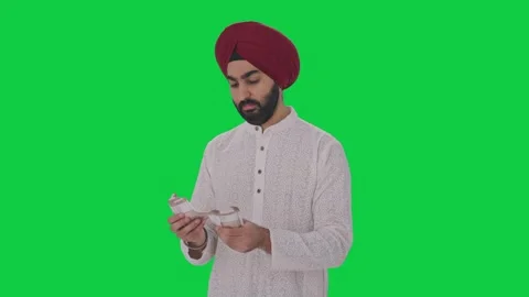 Sikh Indian man counting money Green scr... | Stock Video | Pond5