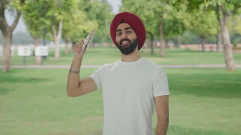 Sikh Indian man using money as fan in at... | Stock Video | Pond5