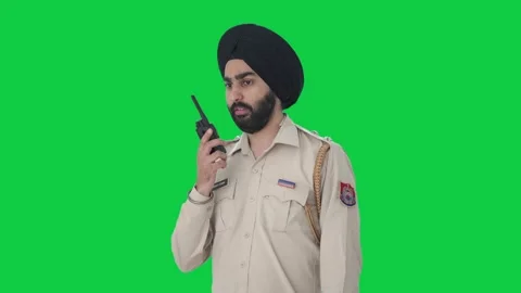 Sikh Indian police man talking on radio ... | Stock Video | Pond5
