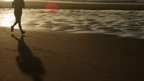 Silhouette and shadow of man running on ... | Stock Video | Pond5