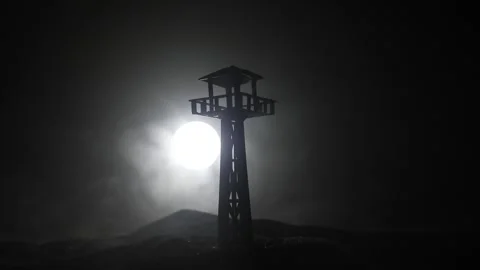 Silhouette of army watchtower at night | Stock Video | Pond5