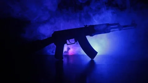 Silhouette of assault rifle on toned fog... | Stock Video | Pond5