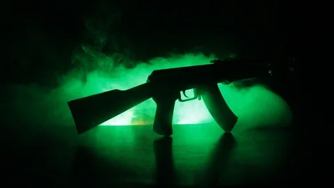 Silhouette of assault rifle on toned fog... | Stock Video | Pond5