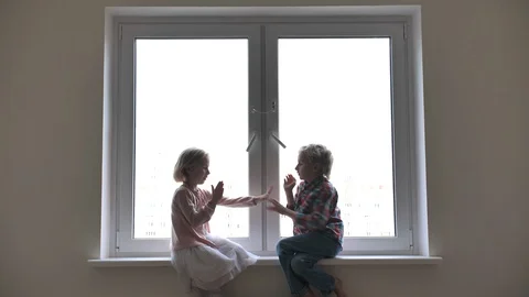 Kids Playing Window Stock Footage ~ Royalty Free Stock Videos | Pond5