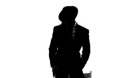 Silhouette Elegant man in a black hat is... | Stock Video | Pond5