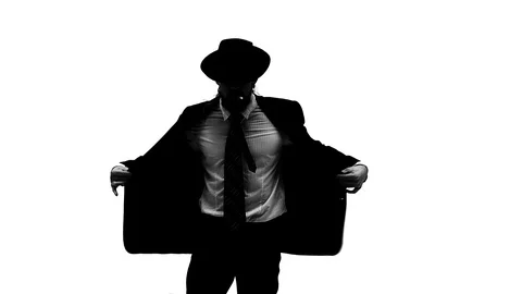 Silhouette Elegant man in a black hat is... | Stock Video | Pond5