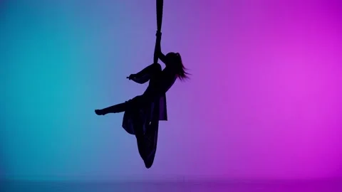 Silhouette of female acrobat isolated on... | Stock Video | Pond5