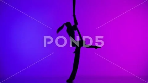 Photograph: Silhouette of female acrobat isolated on colorful neon ...