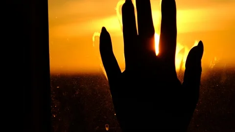 Silhouette Female Hand on Glass Window A... | Stock Video | Pond5