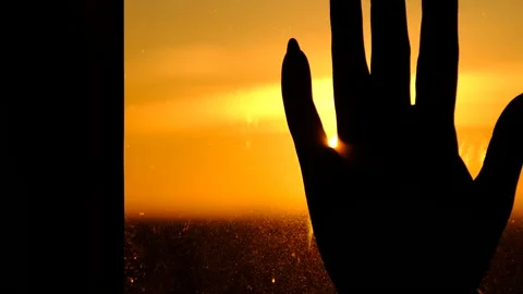 Silhouette Female Hand on Glass Window A... | Stock Video | Pond5