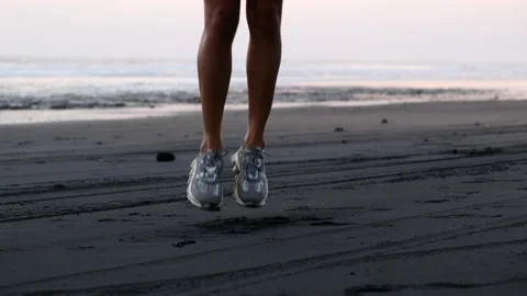 Silhouette of girl's legs jumping on the... | Stock Video | Pond5