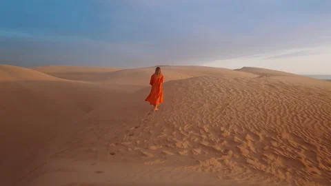 Silhouette of happy woman running in des... | Stock Video | Pond5