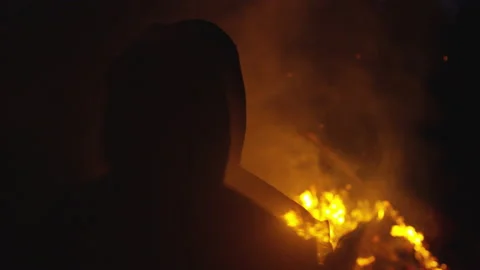 Silhouette of a Hooded Figure Standing i... | Stock Video | Pond5