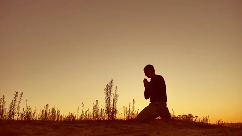 Silhouette illustration of a man praying... | Stock Video | Pond5