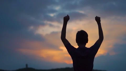 Silhouette of an Indian kid raising his ... | Stock Video | Pond5