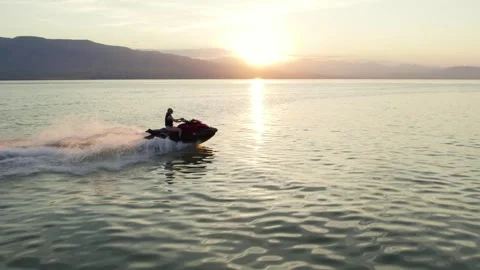 Silhouette of Jet Ski Rider on Waverunne... | Stock Video | Pond5