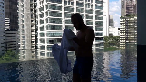 Silhouette of man drying his body by swi... | Stock Video | Pond5