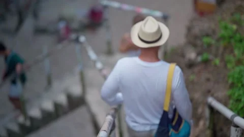 silhouette of a man in a hat going down ... | Stock Video | Pond5