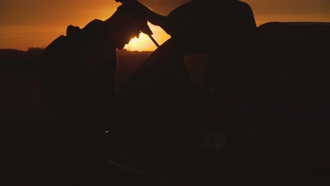 Silhouette of man opening boot and putti... | Stock Video | Pond5