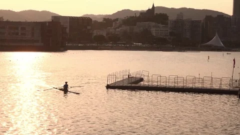 Silhouette of man rowing in front of sun... | Stock Video | Pond5