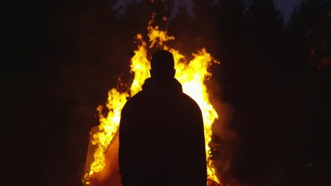Silhouette of Man Standing in Front of B... | Stock Video | Pond5