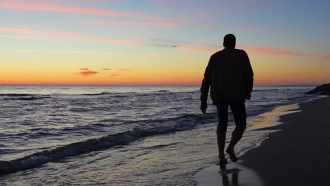 Silhouette of a man stomping barefoot on... | Stock Video | Pond5