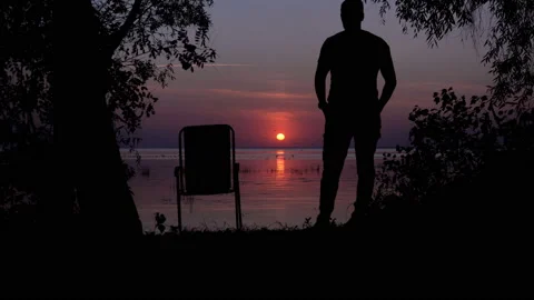 Silhouette of People resting at sunset n... | Stock Video | Pond5