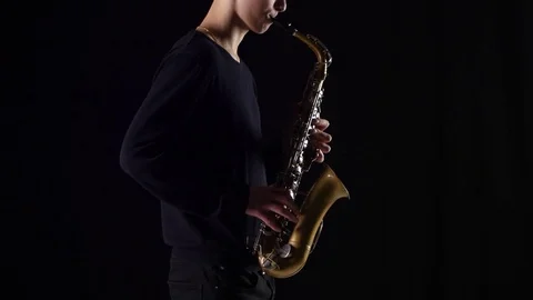 Silhouette of a sax player. Man playing ... | Stock Video | Pond5