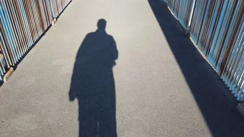 Silhouette shadow of a man while walking... | Stock Video | Pond5