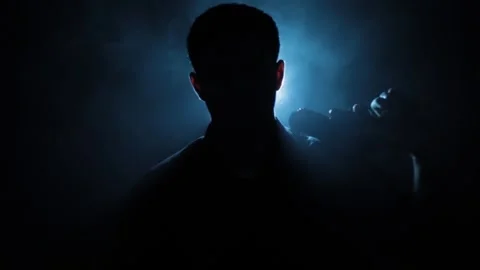 Silhouette shot of a mafia boss or a hit... | Stock Video | Pond5