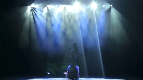 Silhouette of singer on stage at smoky b... | Stock Video | Pond5