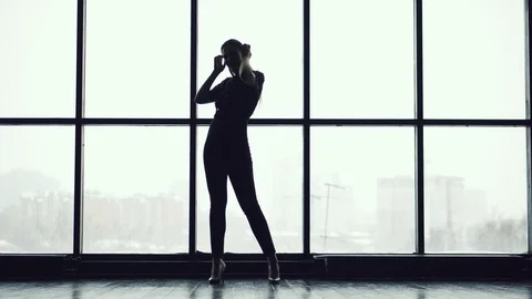 silhouette of a slim girl dancing on the... | Stock Video | Pond5