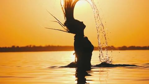 Silhouette of Woman Flipping Her Long Ha... | Stock Video | Pond5
