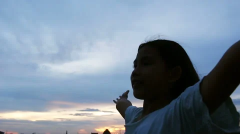 Silhouette of woman open arms to the sky... | Stock Video | Pond5