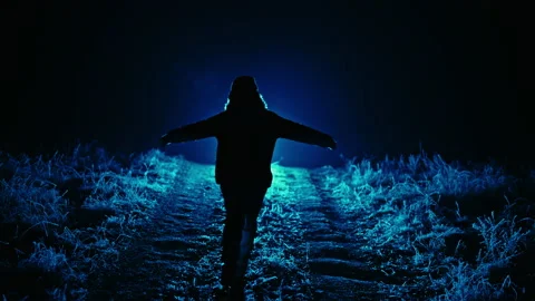 Silhouette of woman walking in blue spot... | Stock Video | Pond5