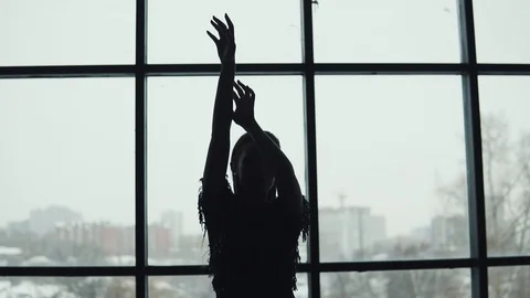 silhouette of a young slim girl dancing ... | Stock Video | Pond5