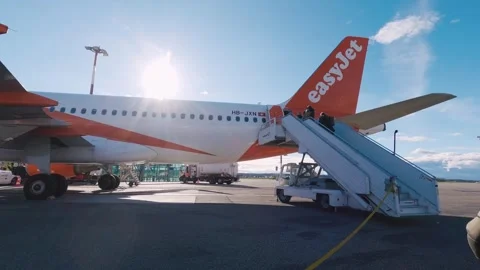 Silhouetted figure walking towards EasyJ... | Stock Video | Pond5