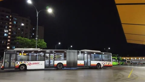 Singapore SMRT Bendy Bus at Interchange | Stock Video | Pond5