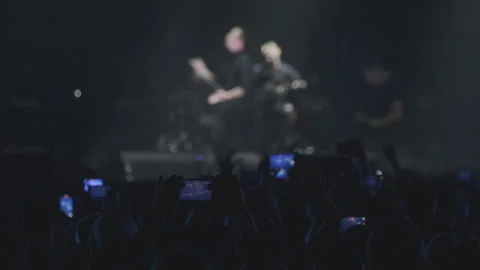 Singer with band on stage in spotlight | Stock Video | Pond5