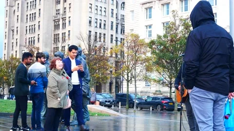 Singer busker performing alongside Beetl... | Stock Video | Pond5